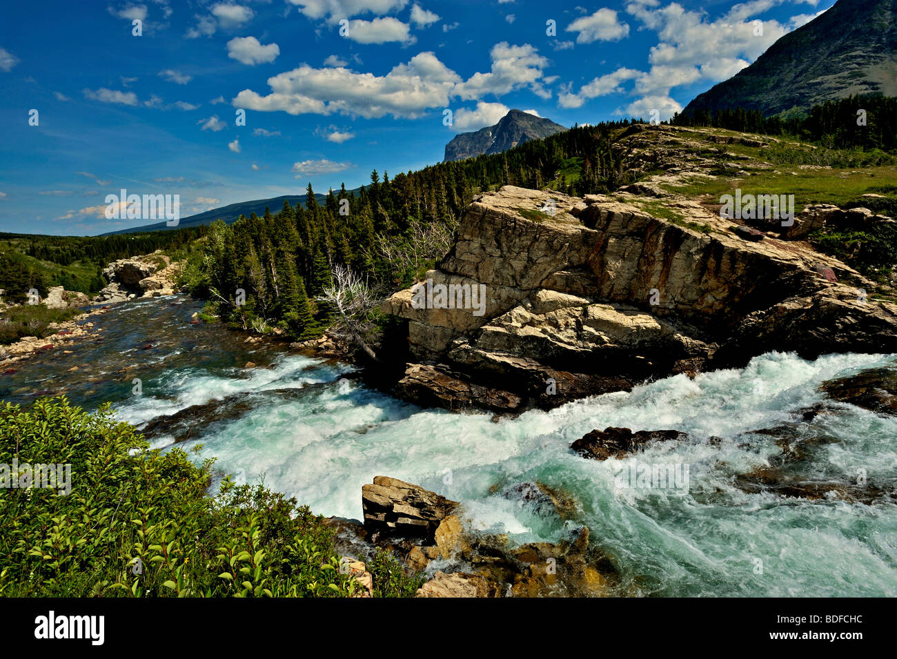 A fast flowing stream in Glacier national park Stock Photo - Alamy