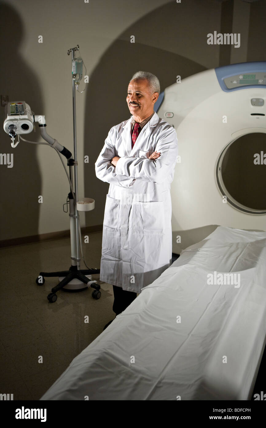 African American radiologist by CT scanner Stock Photo - Alamy