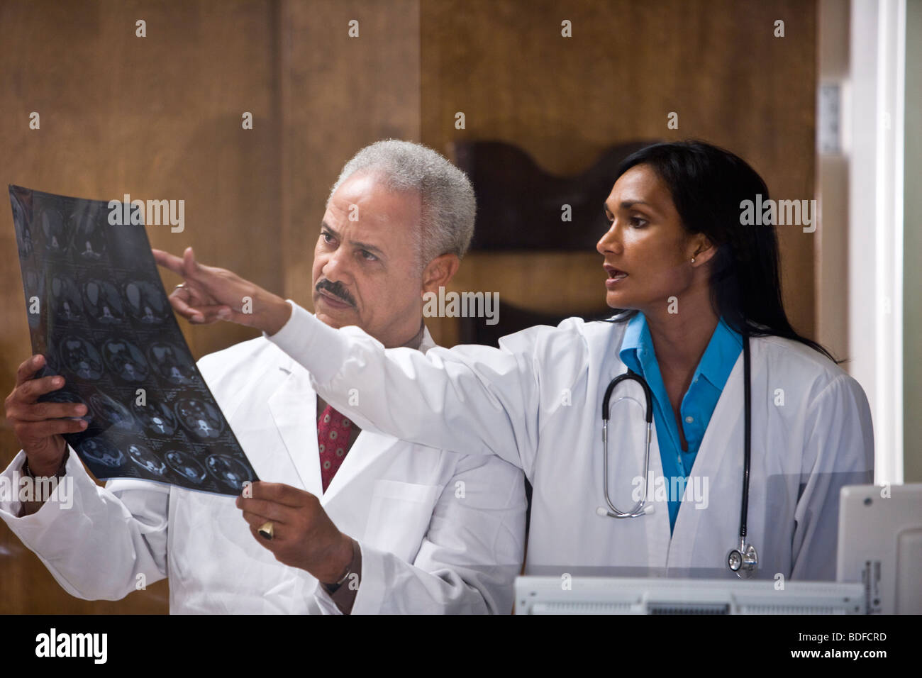Doctor reviewing ct scan results hi-res stock photography and images ...