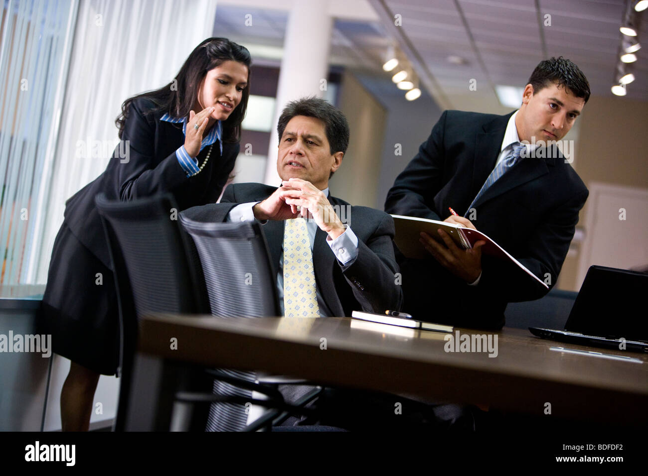 Hispanic businesspeople in office meeting Stock Photo - Alamy