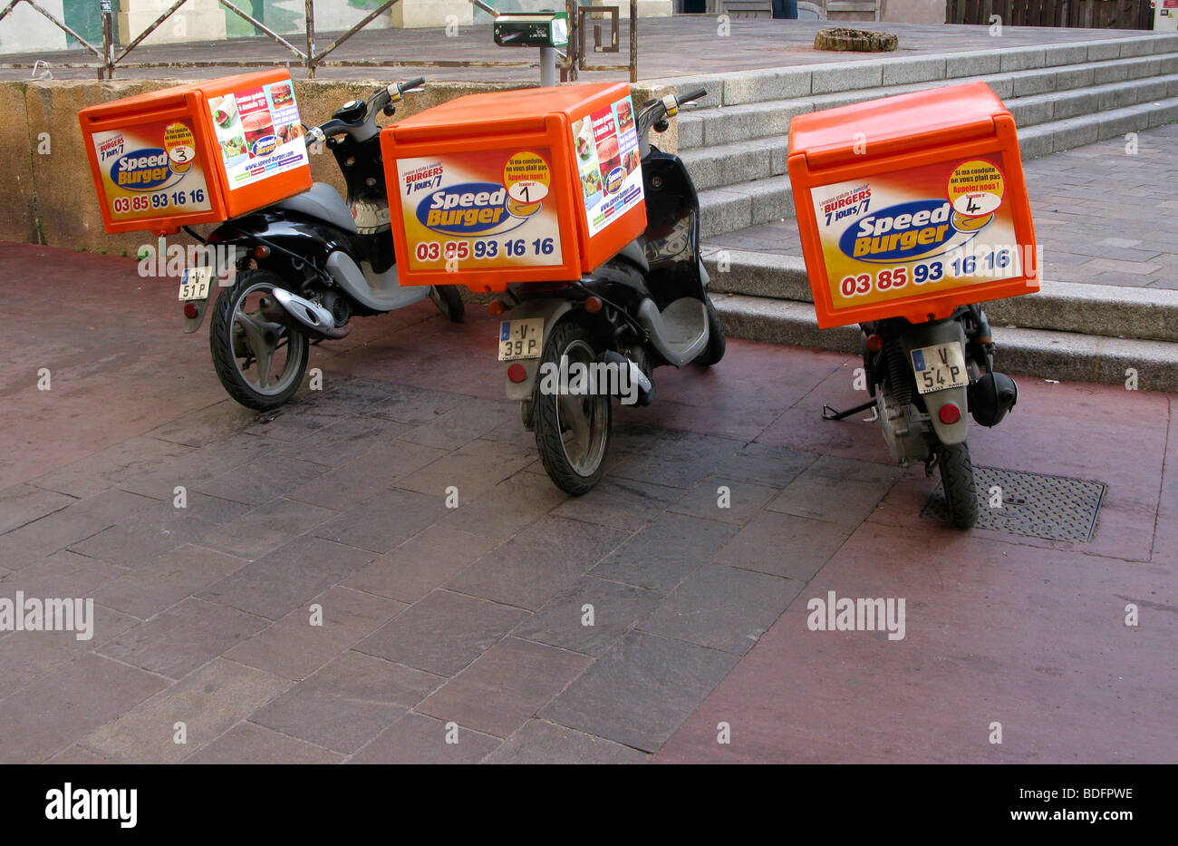 fast food delivery vehicles motocycles Stock Photo - Alamy