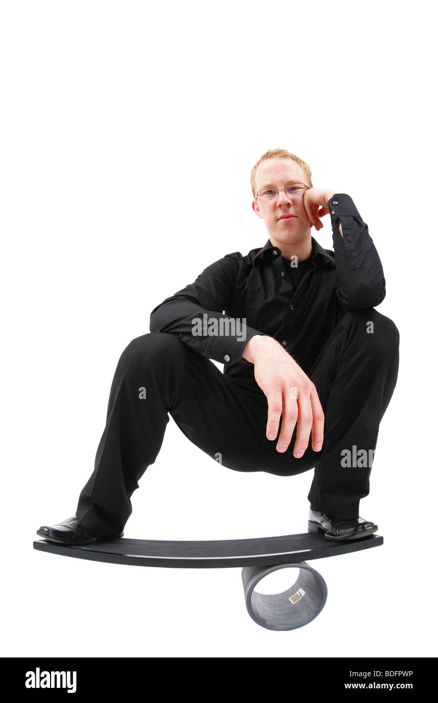 young man on board balancing on roll Stock Photo - Alamy
