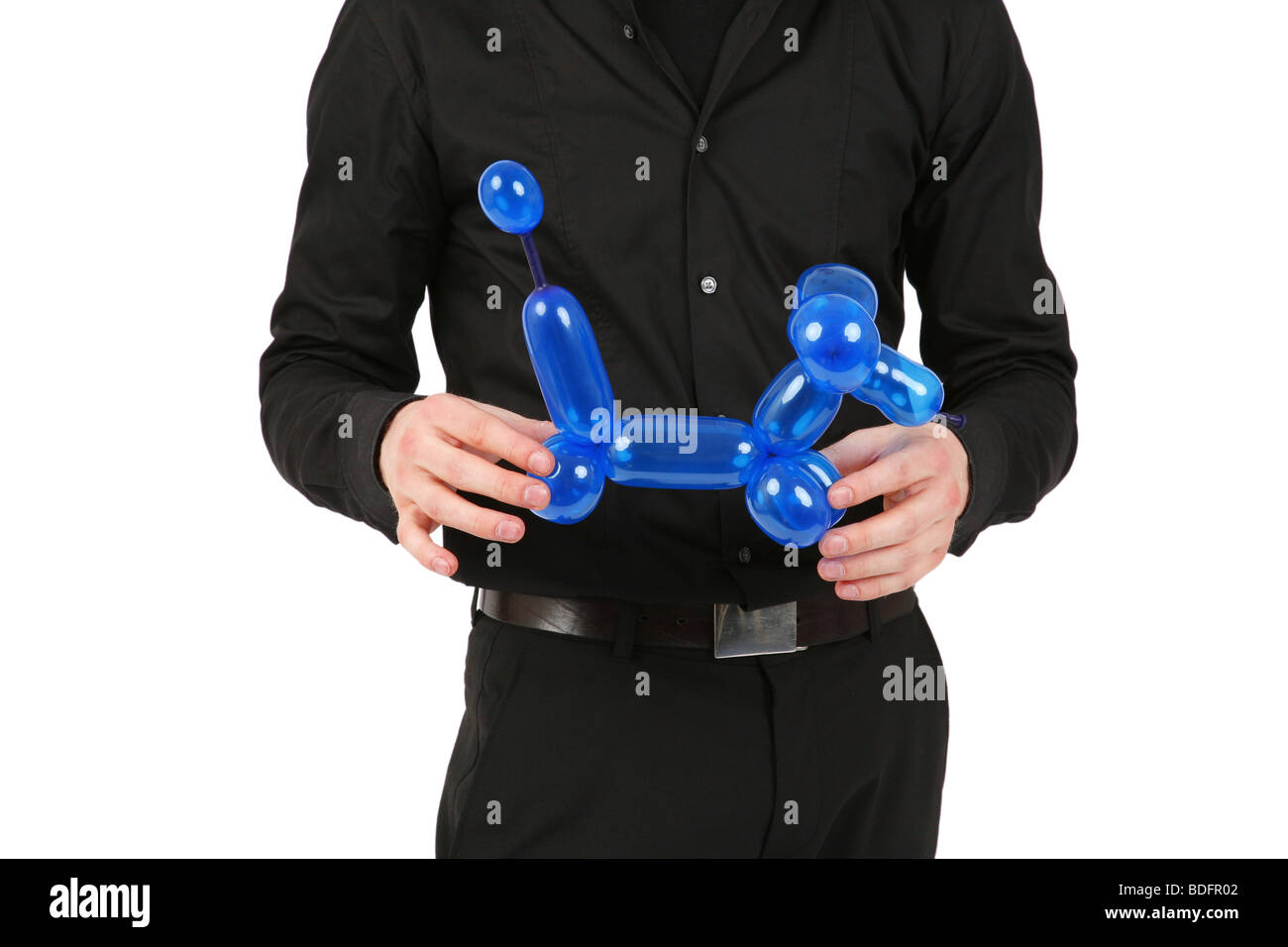 young magic tinkering a balloon animal with balloons Stock Photo - Alamy