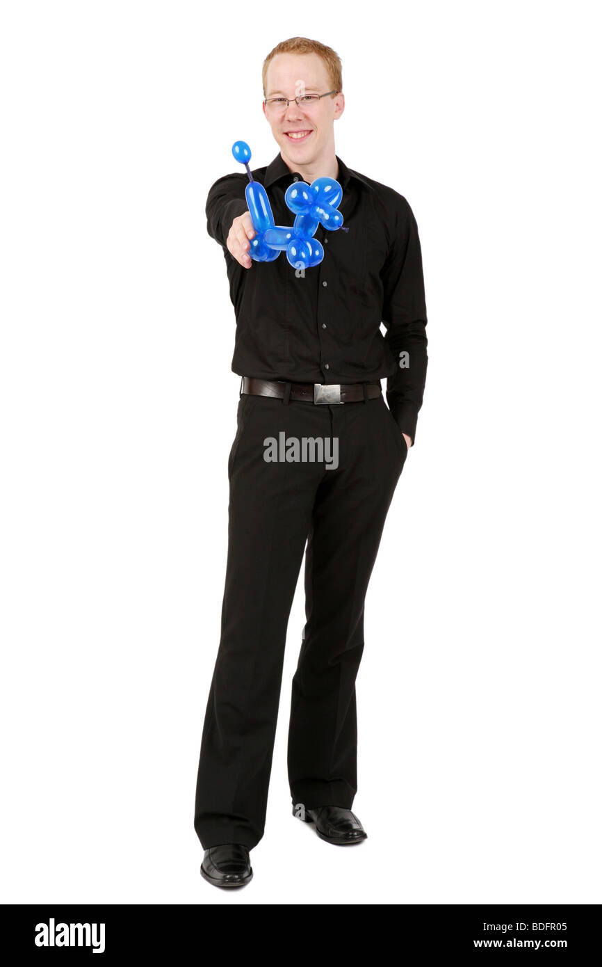 young magic tinkering a balloon animal with balloons Stock Photo - Alamy