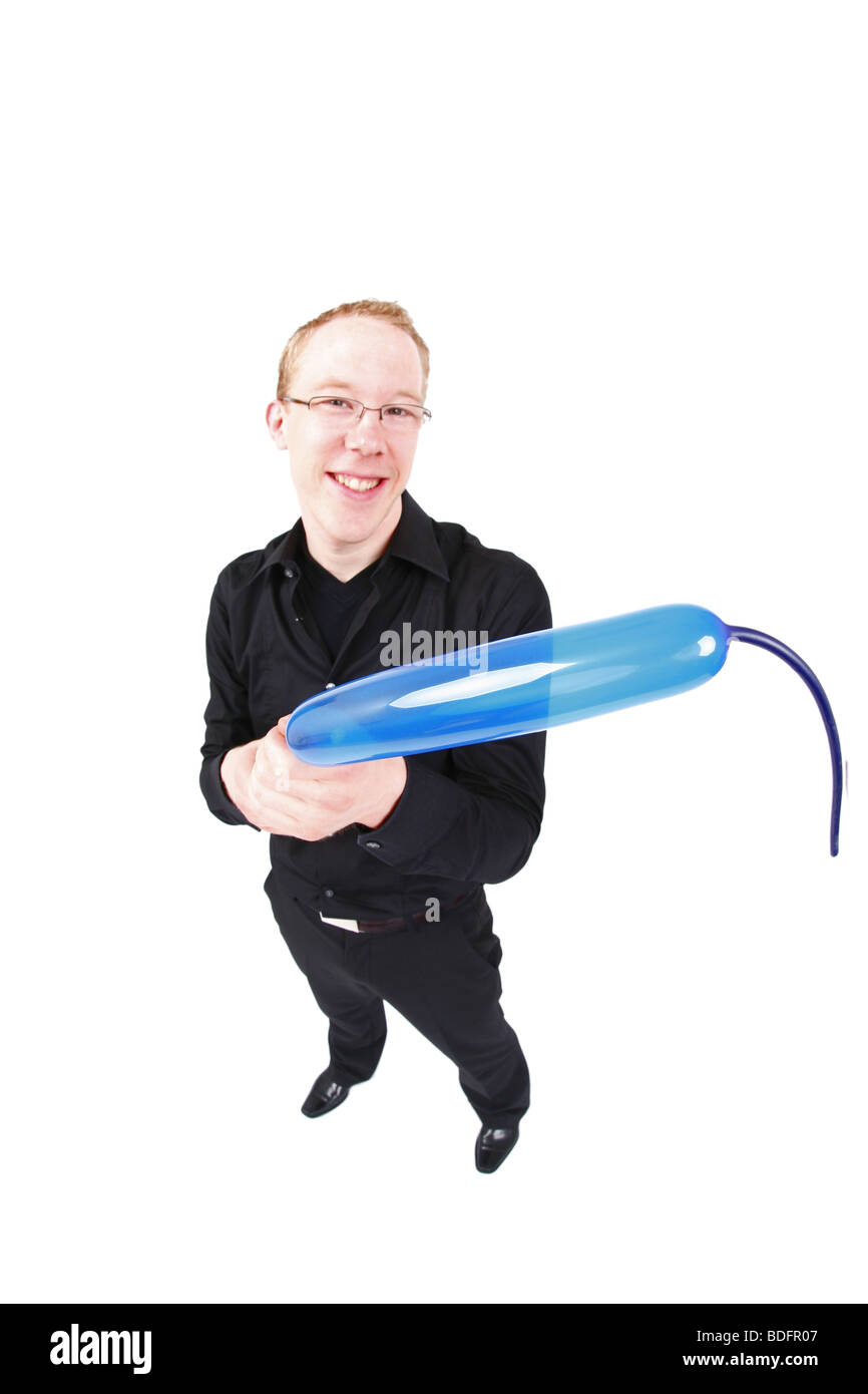 young magic tinkering a balloon animal with balloons Stock Photo - Alamy