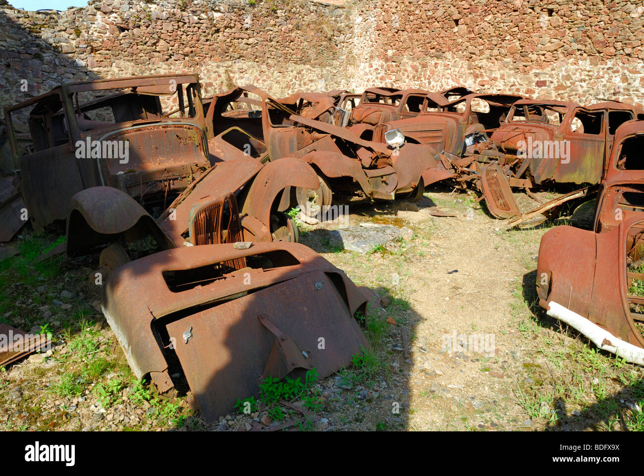 Rusting cars in the Martyred Village of Oradour-sur-Glane Stock Photo ...