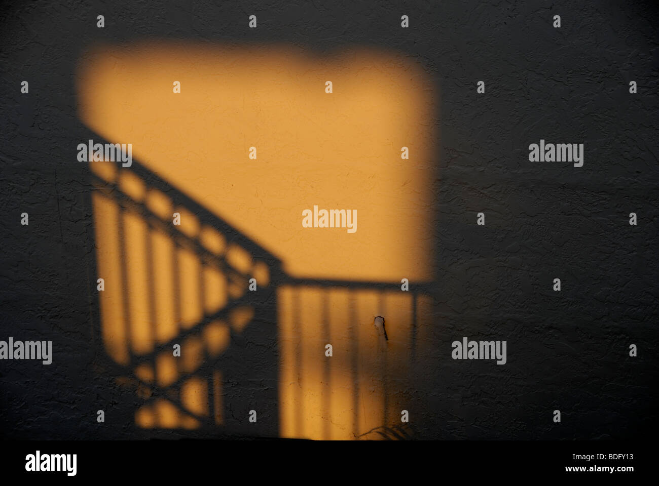 Interesting shadow on warm wall Stock Photo - Alamy