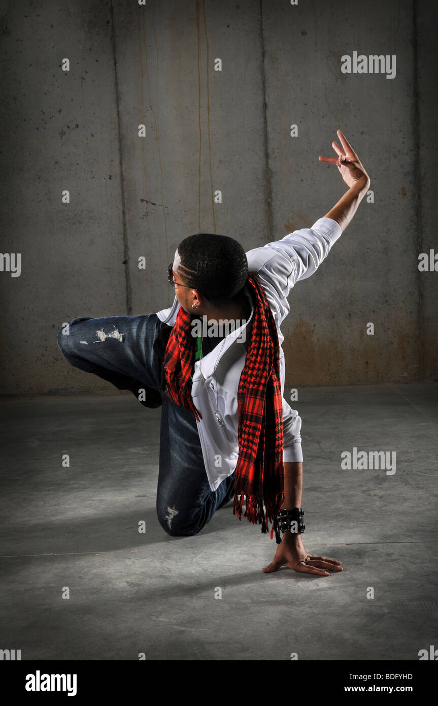 African American hip hop dancer performing over grunge background Stock ...