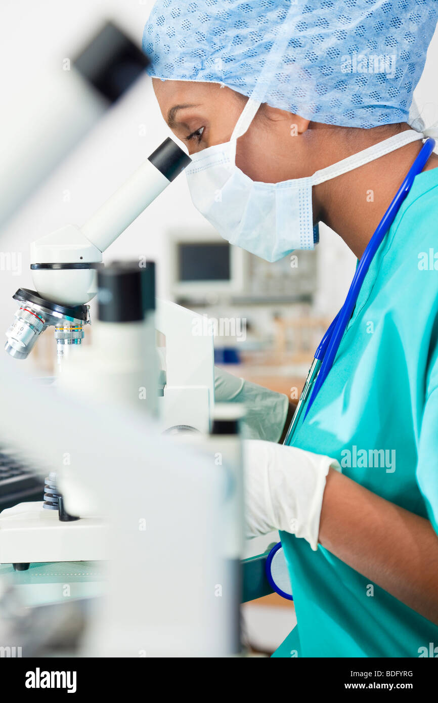 Indian doctor with microscope hi-res stock photography and images - Alamy