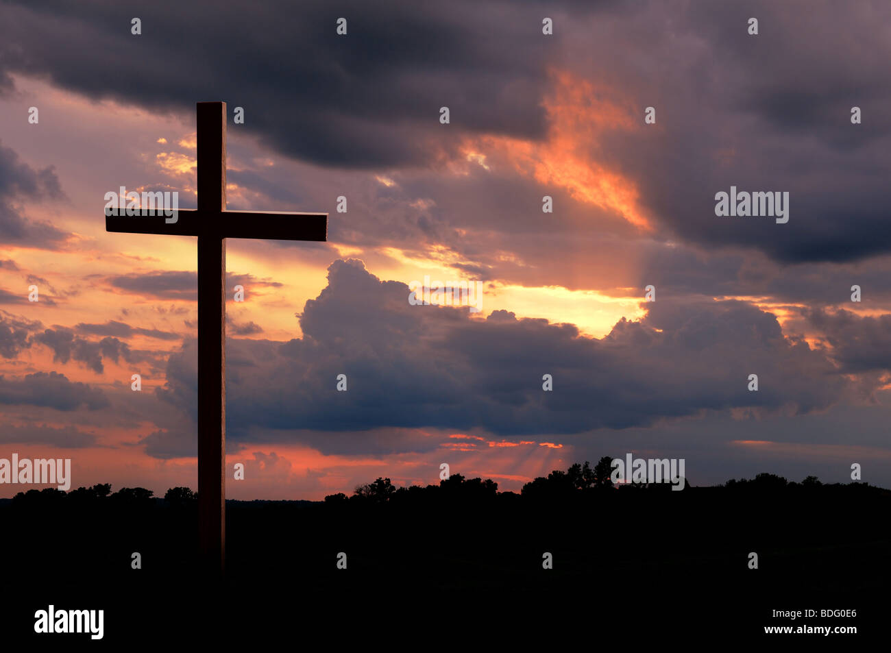 Wooden cross over a sunset Stock Photo - Alamy