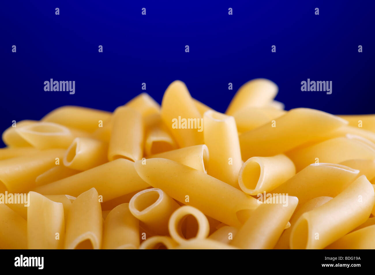 object on blue - macaroni close up Stock Photo - Alamy
