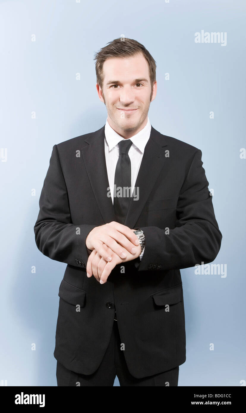 Businessman with a watch Stock Photo - Alamy