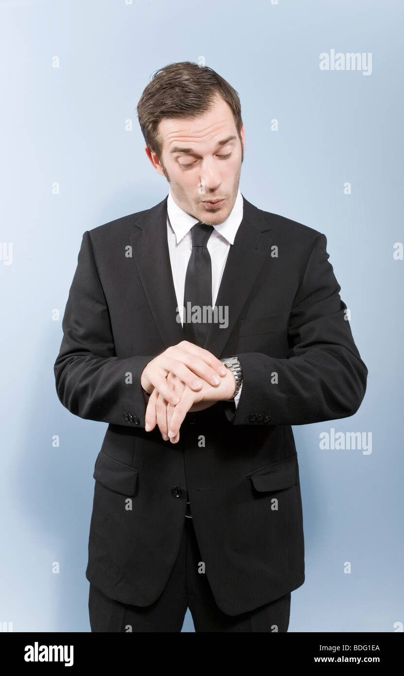 Businessman with a watch Stock Photo - Alamy