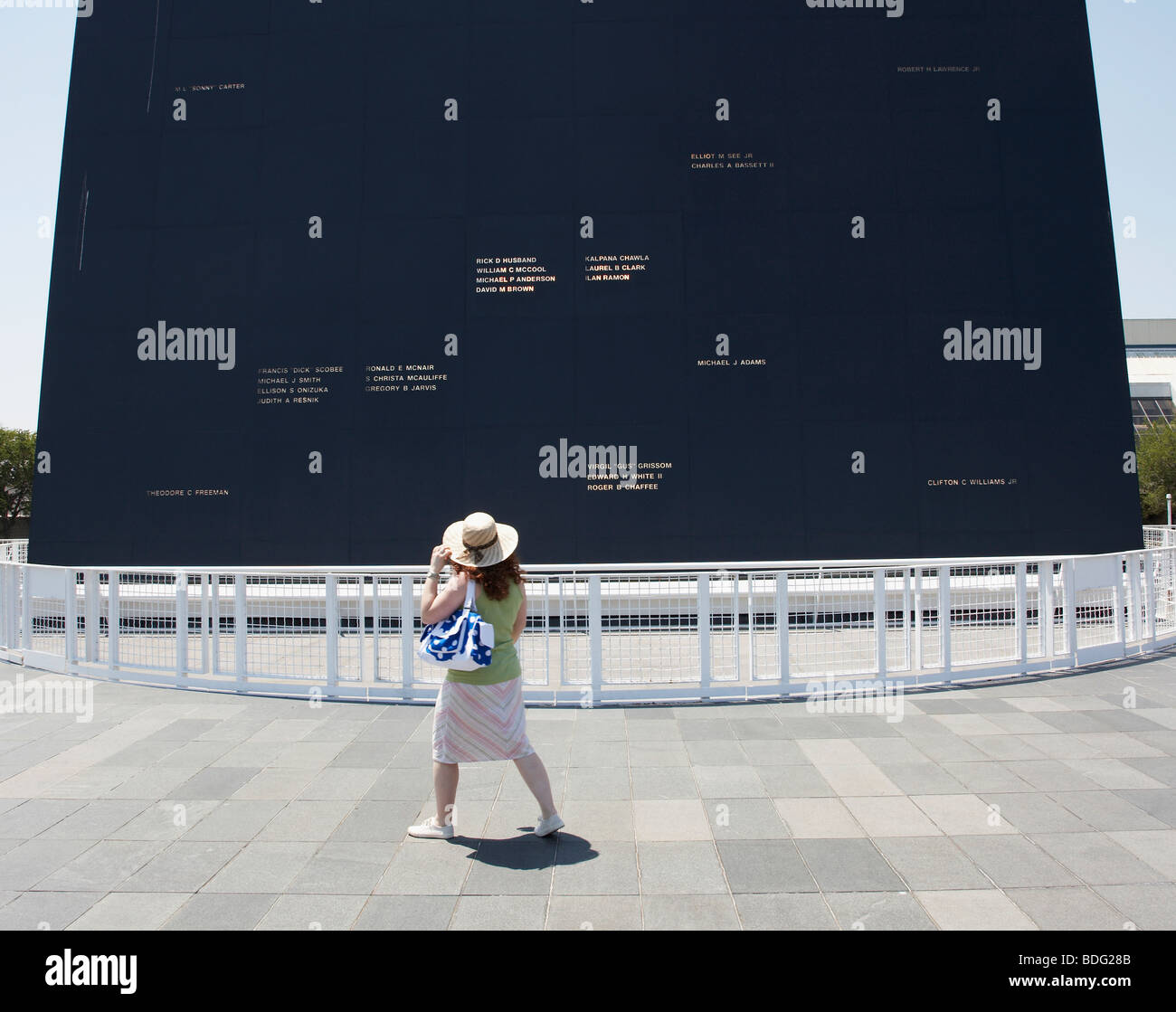 lady holding hat in front of NASA memorial Stock Photo - Alamy