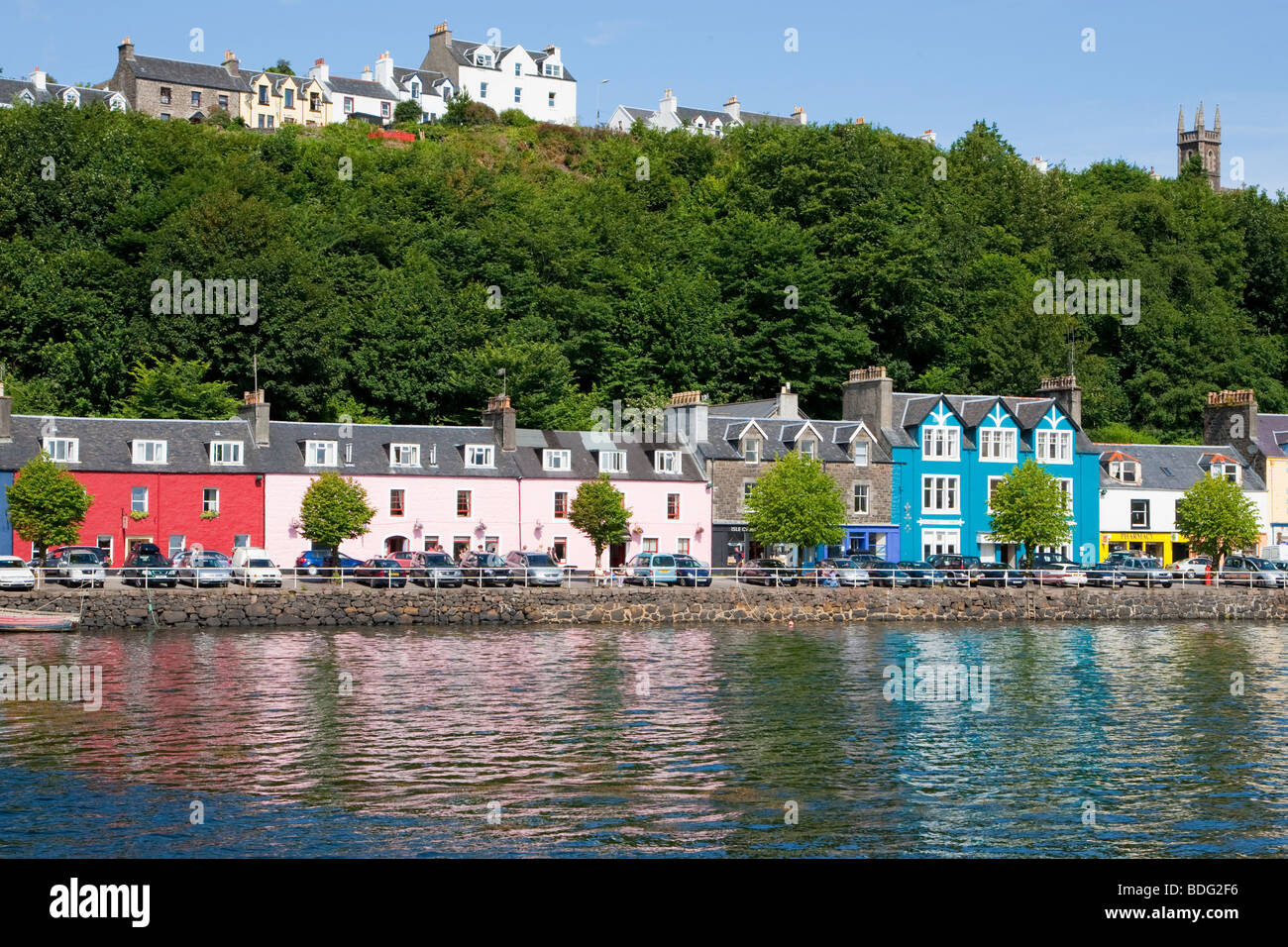 Tobermory waterfront in summer with colourful buildings and reflective ...