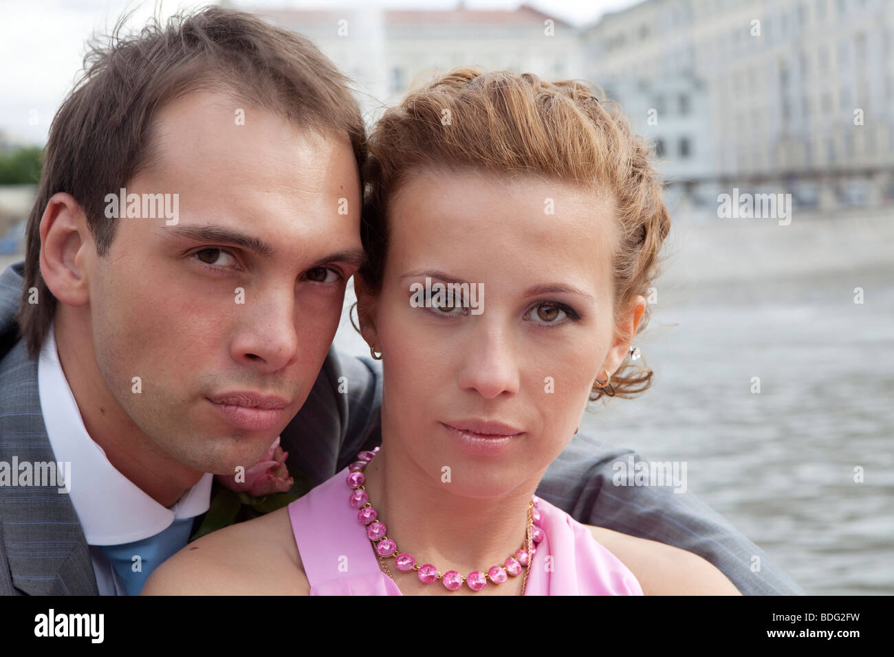 the newly married couple at city. Bride in pink dress Stock Photo - Alamy