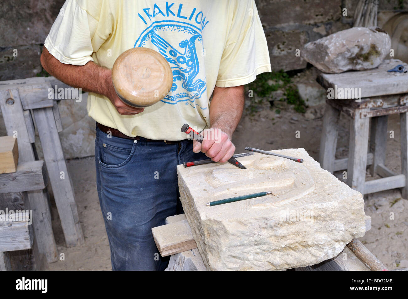 Sculptor working on a stone Stock Photo - Alamy