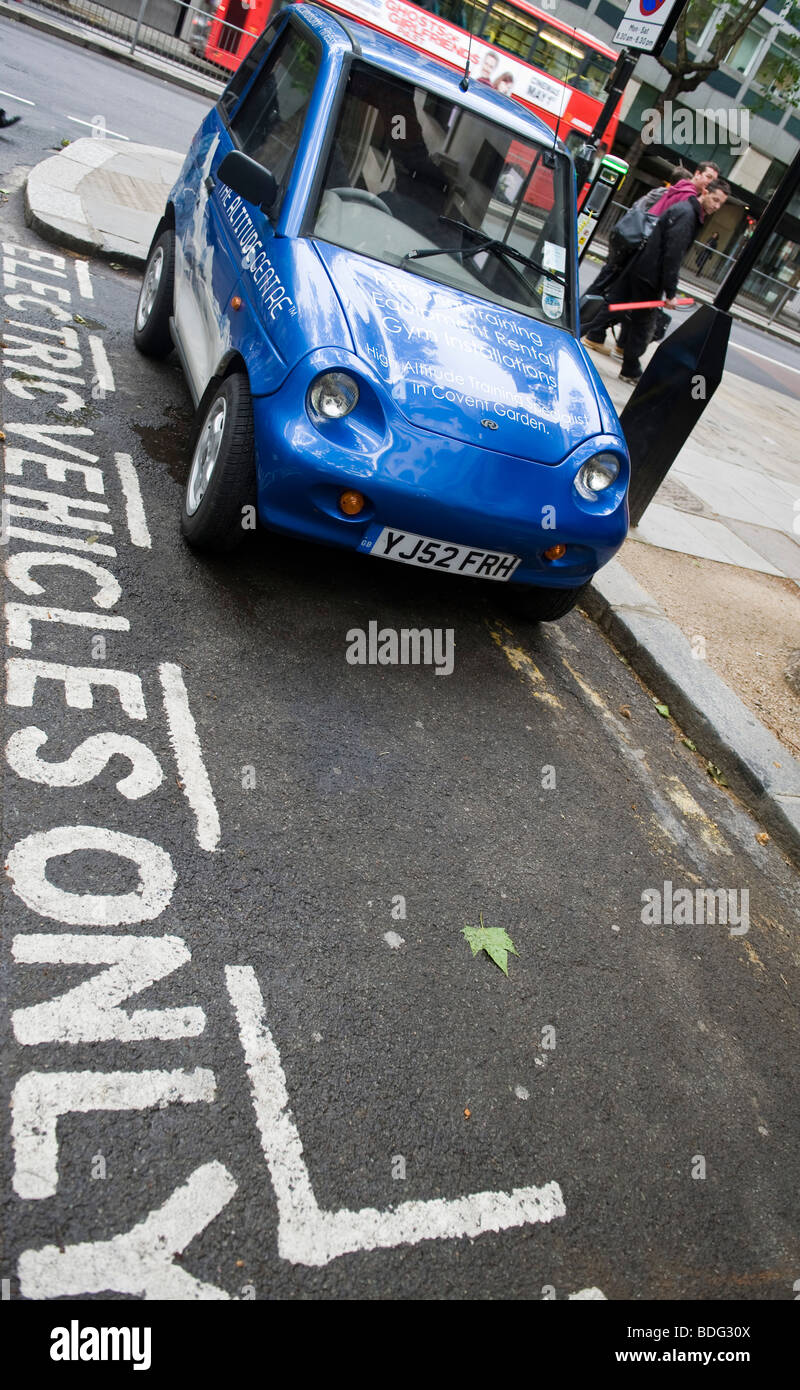 Electric car at charging point Stock Photo - Alamy