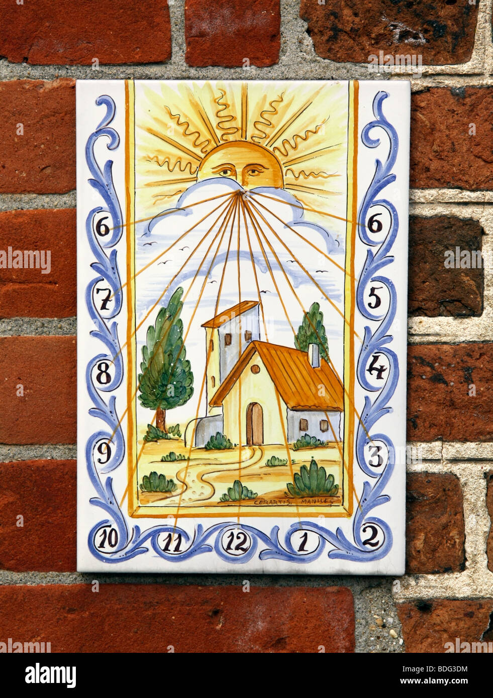 Vintage tile depicting the sun and a house Stock Photo - Alamy