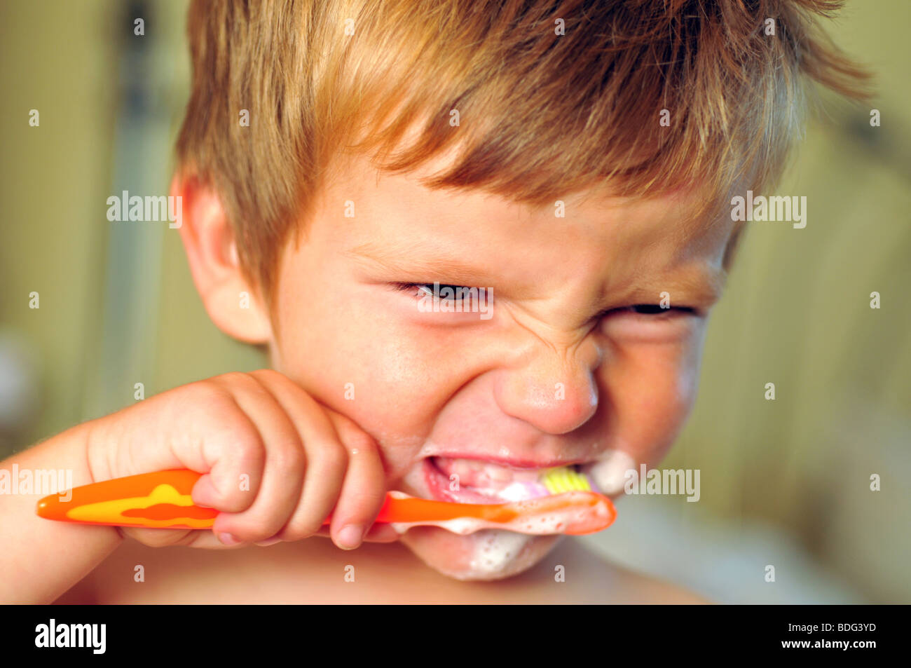 Boy cleaning his teeth, child brushing his teeth with a toothbrush ...