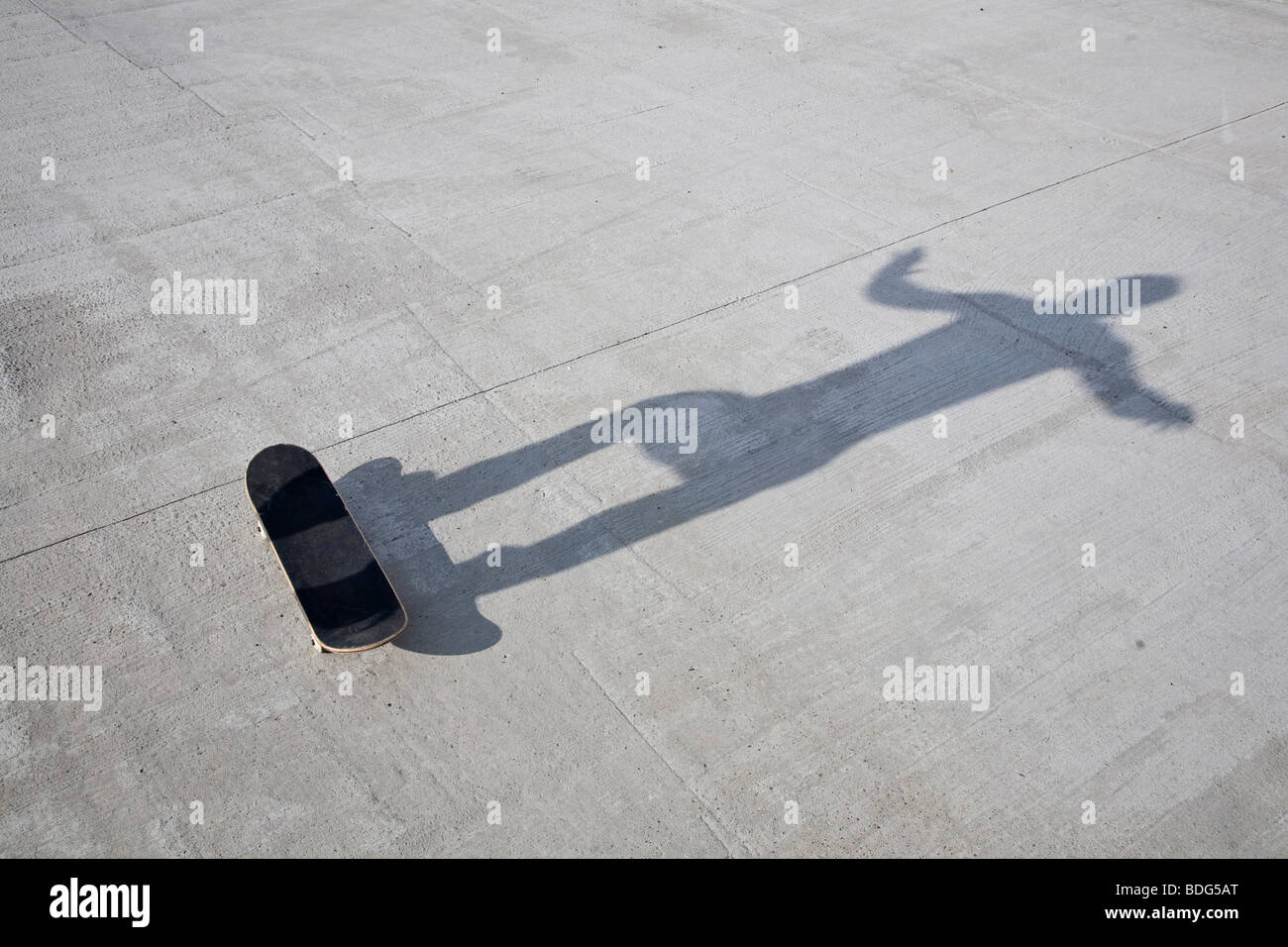 Shadow on a skateboard Stock Photo - Alamy