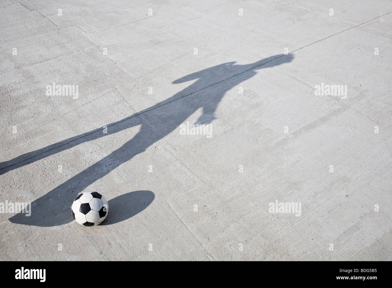 Shadow playing football Stock Photo - Alamy