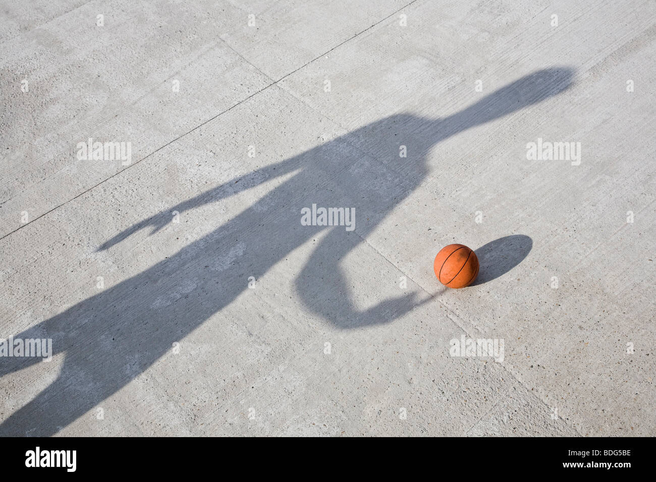 Shadow playing basketball Stock Photo - Alamy