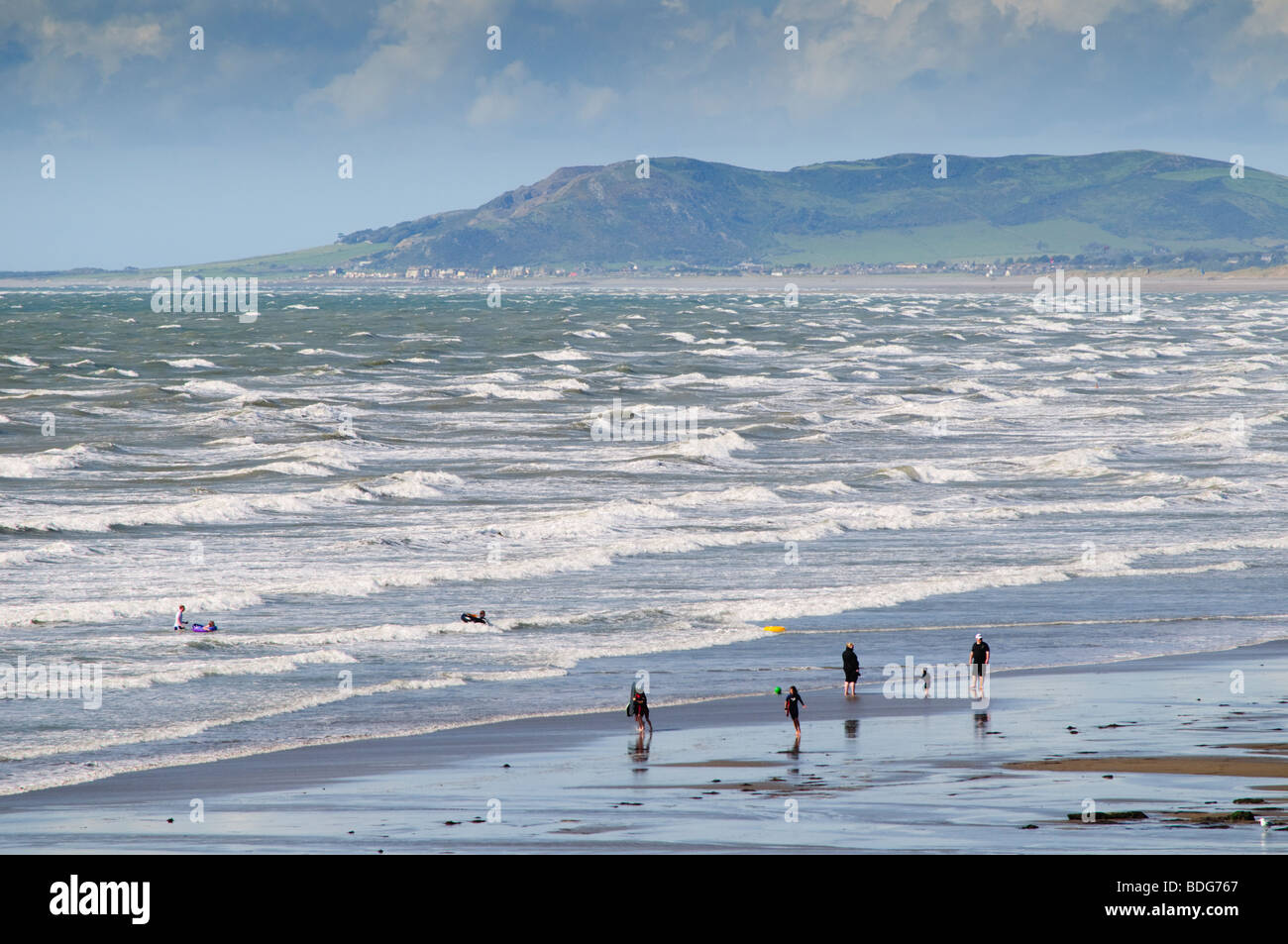 People walking on the beach at Borth, Cardigan Bay coast, Ceredigion ...