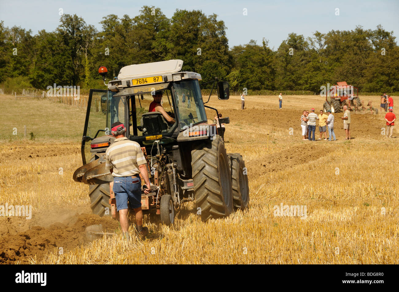 Stock photo of tractors ploughing fields in a farming competition in ...