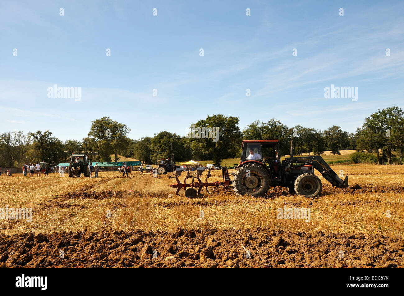 Stock photo of tractors ploughing fields in a farming competition in ...