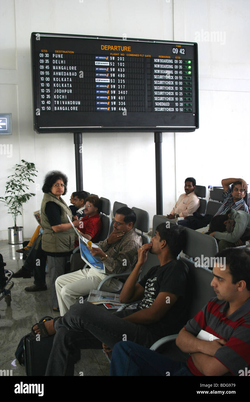 Passenger pax waiting flight information board Stock Photo - Alamy
