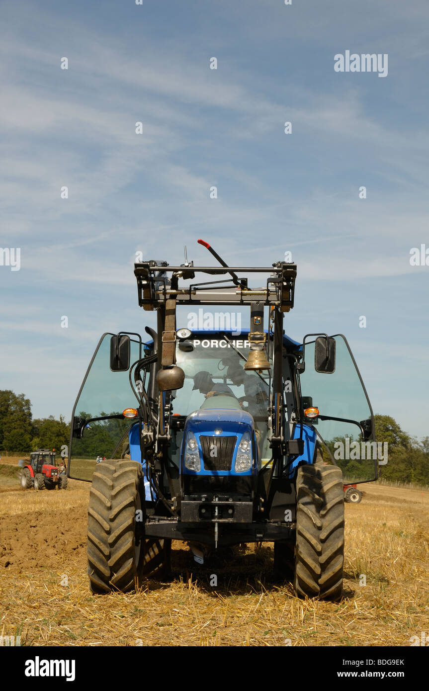 Stock photo of tractors ploughing fields in a farming competition in ...