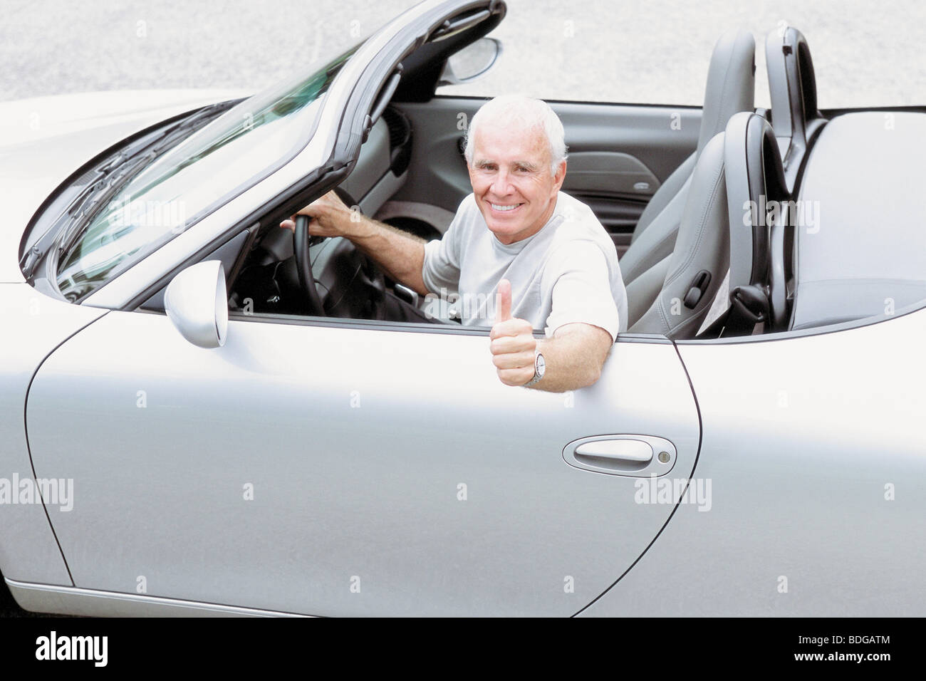 Portrait of a senior man and a convertible Stock Photo - Alamy