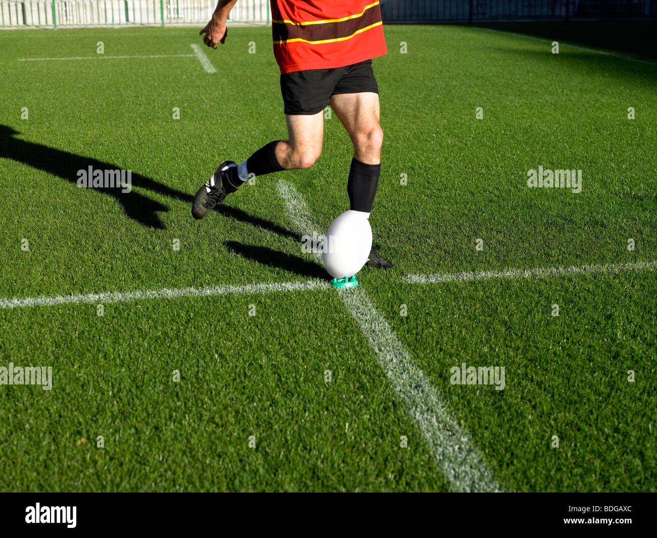 Team action kicking ball hi-res stock photography and images - Alamy