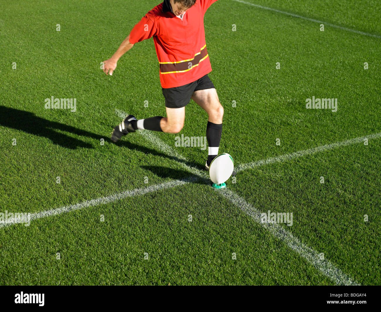 Team action kicking ball hi-res stock photography and images - Alamy