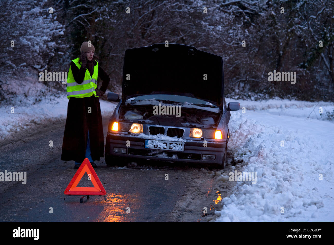 Women on her own broken down in the snow stranded trying to get help on ...