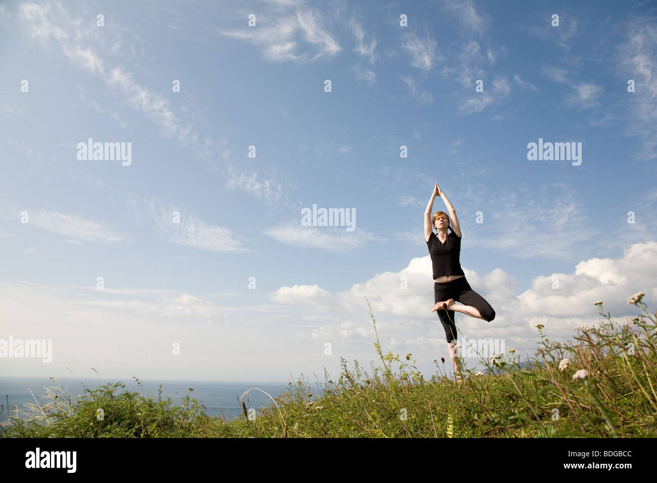 Woman standing in yoga position, outdoor shot Stock Photo - Alamy