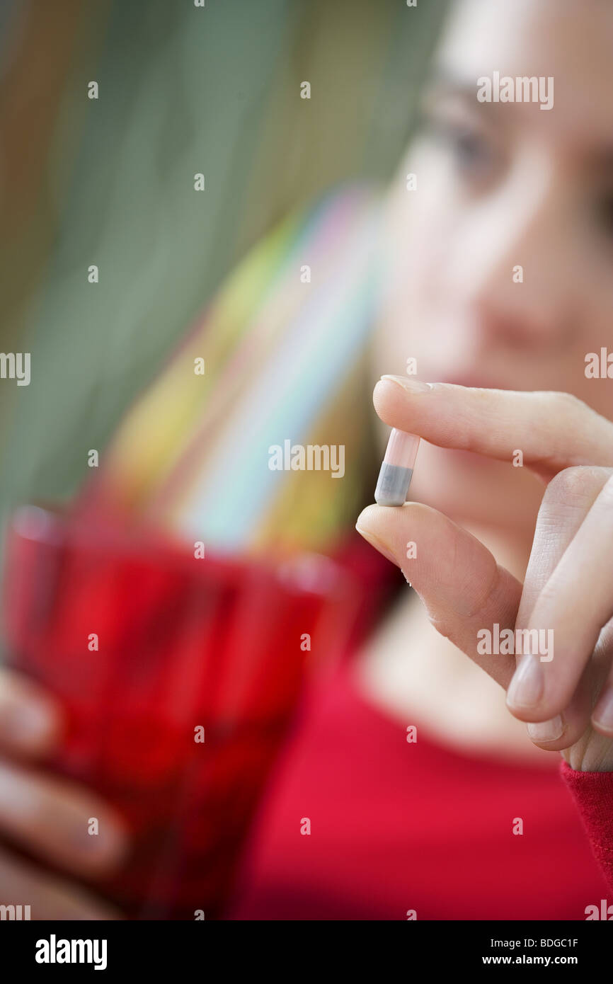 WOMAN TAKING MEDICATION Stock Photo - Alamy