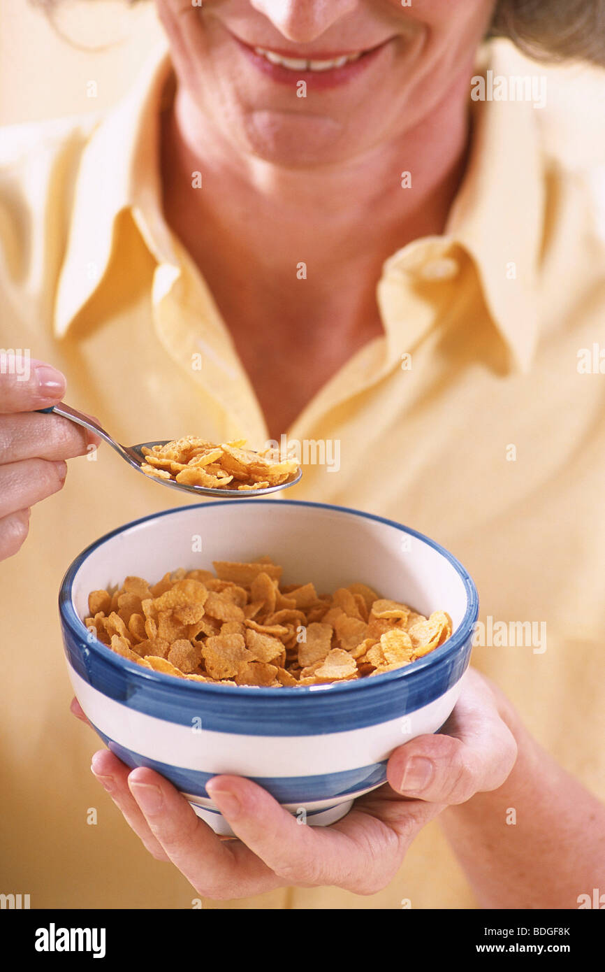 ELDERLY PERSON EATING BREAKFAST Stock Photo - Alamy