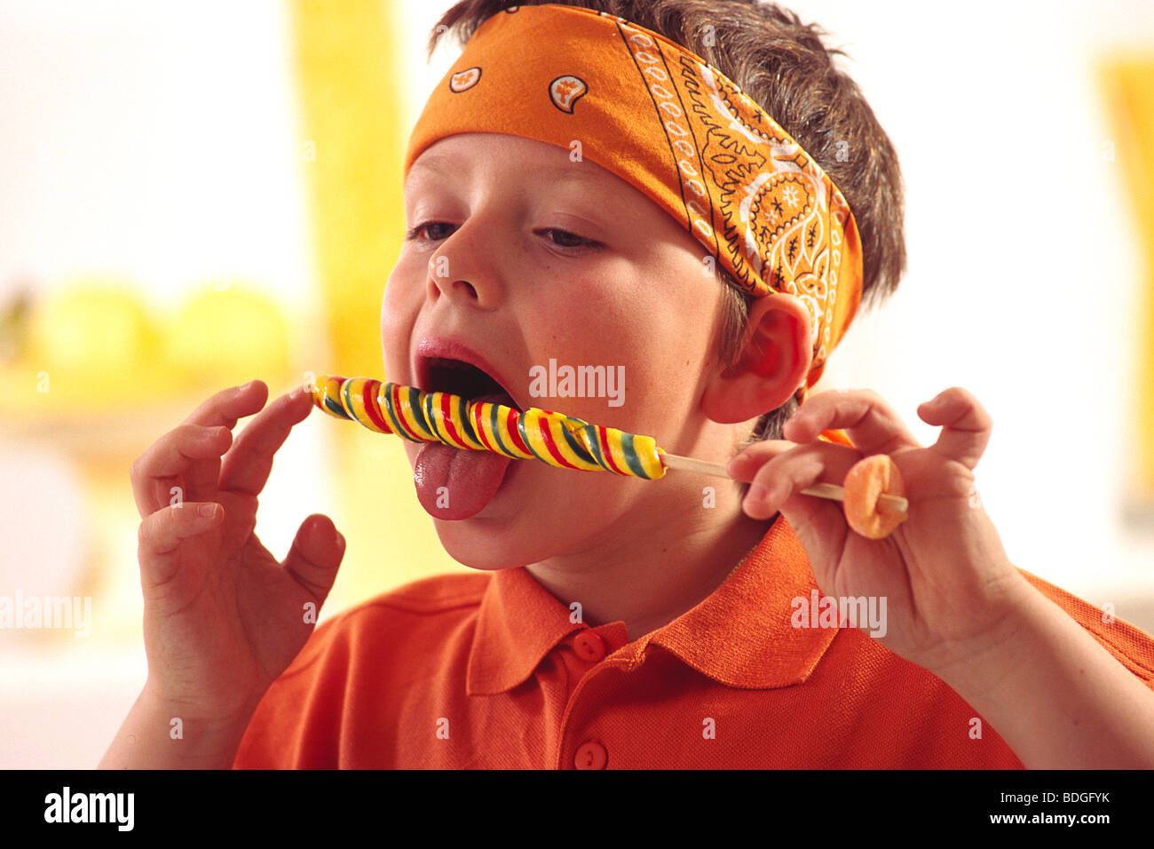 CHILD EATING SWEETS Stock Photo - Alamy
