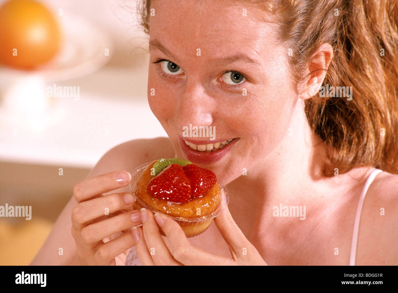 WOMAN EATING SWEETS Stock Photo - Alamy