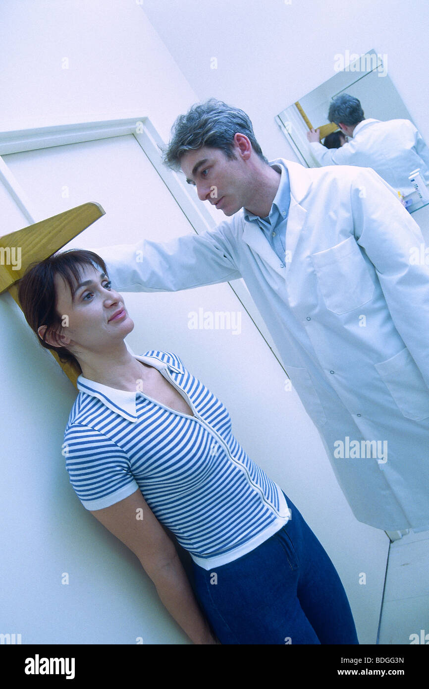 MEASURING HEIGHT IN A WOMAN Stock Photo - Alamy