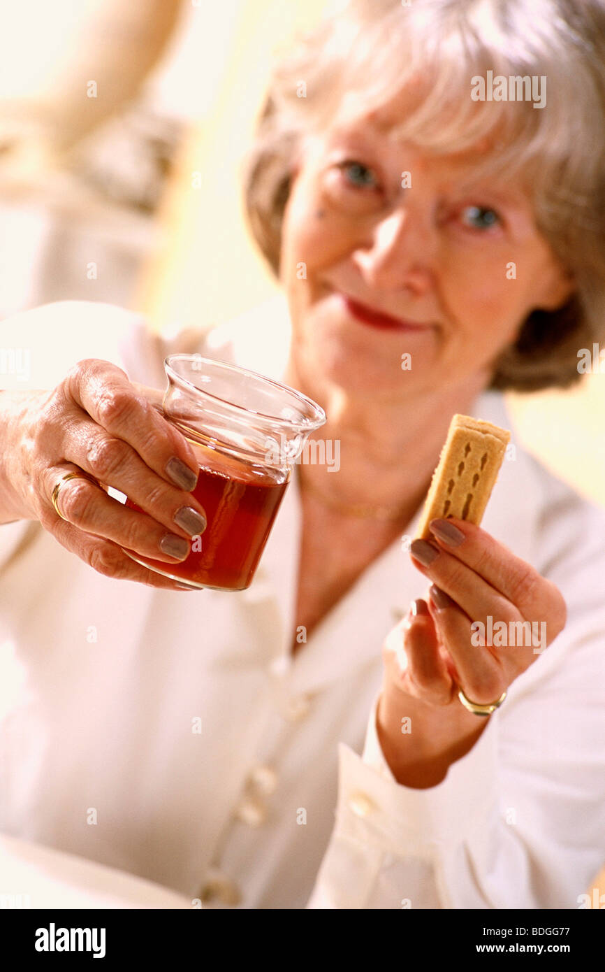 ELDERLY PERSON EATING SWEETS Stock Photo - Alamy