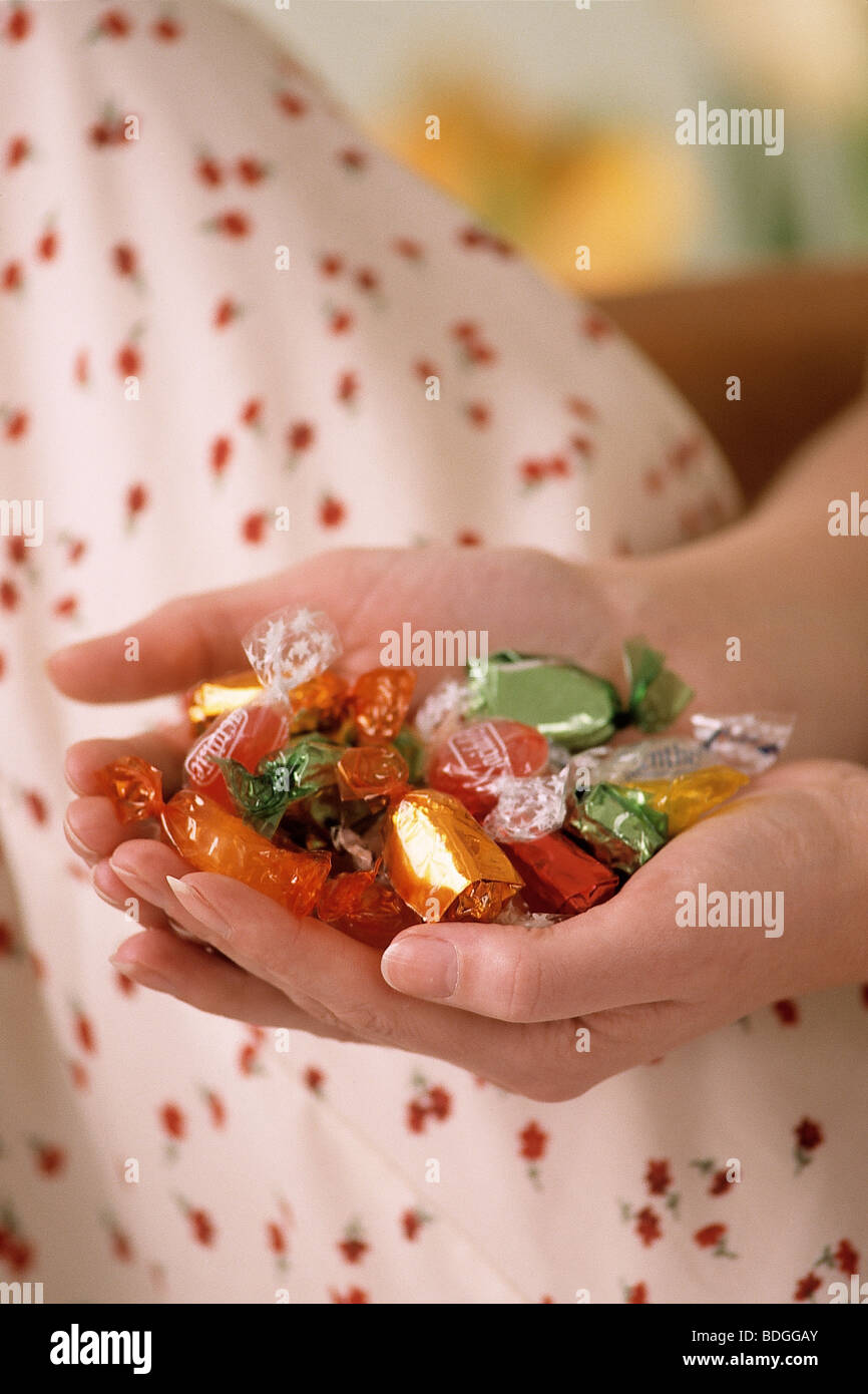 WOMAN EATING SWEETS Stock Photo - Alamy