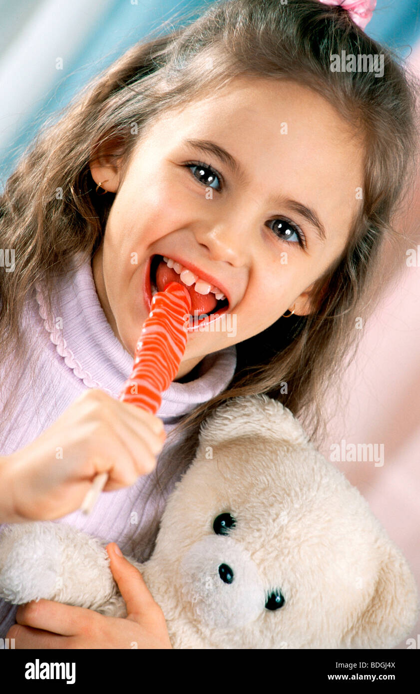 CHILD EATING SWEETS Stock Photo - Alamy