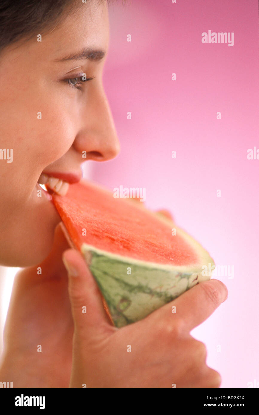 WOMAN EATING FRUIT Stock Photo - Alamy