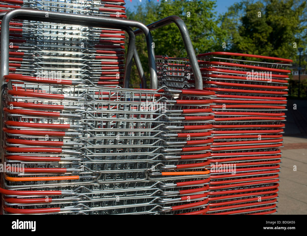 Stacks of wire shopping baskets outside a supermarket in England Stock ...