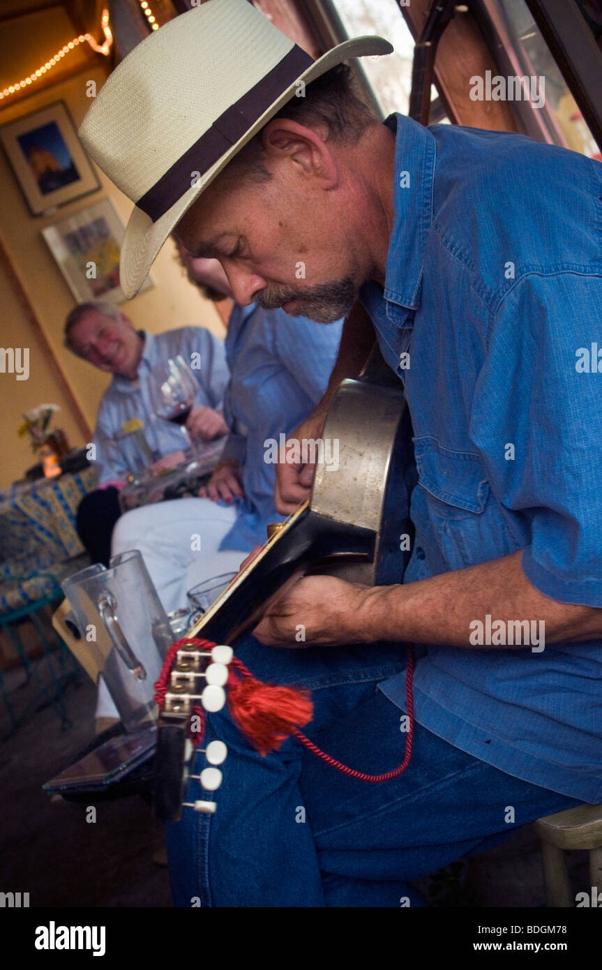 Regional folk singer w straw hat performs in restaurant Stock Photo - Alamy