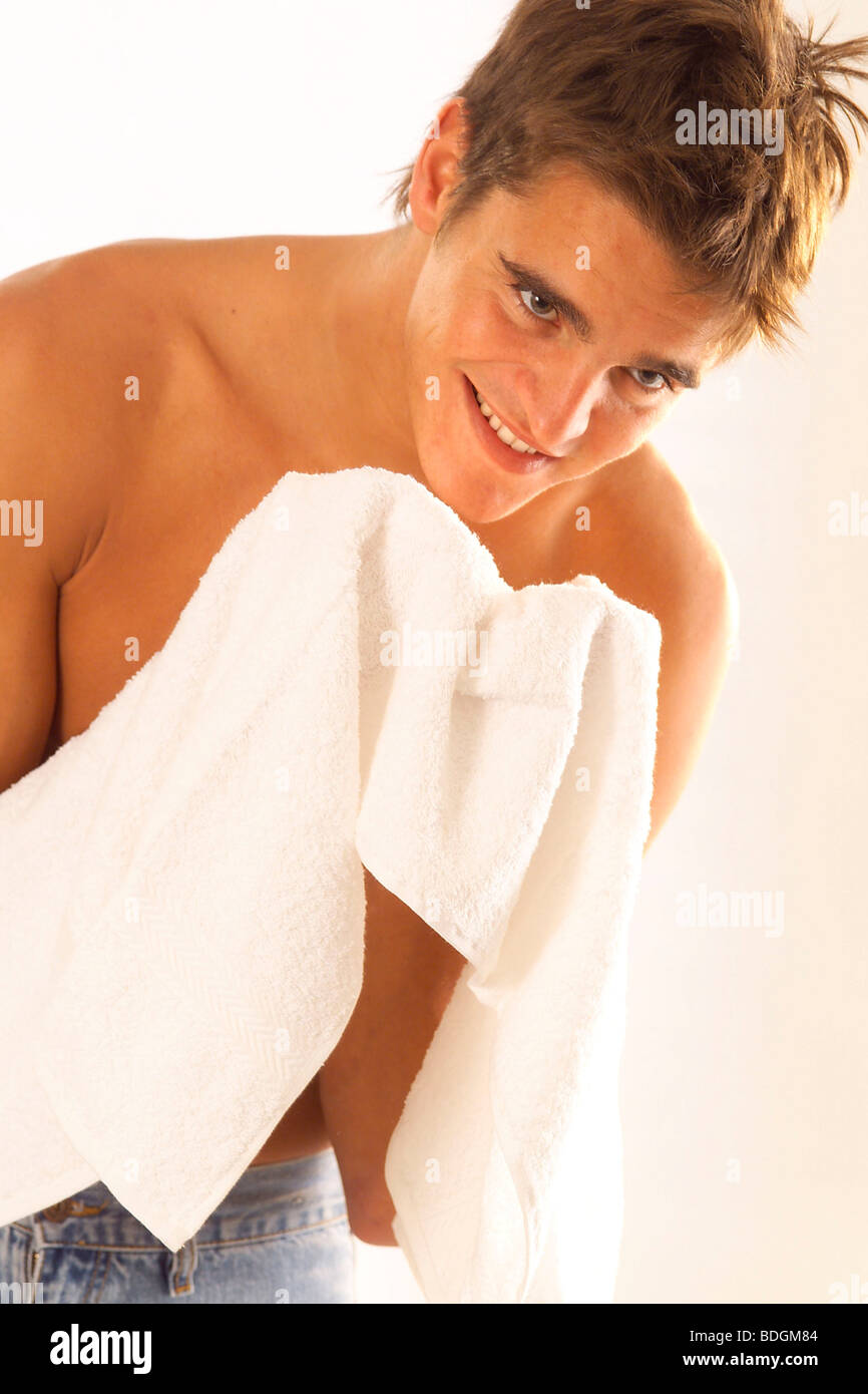 Man washing face drying towel hi-res stock photography and images - Alamy