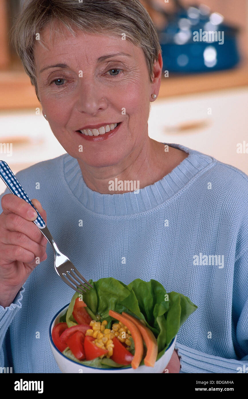 ELDERLY P. EATING RAW VEGETABLES Stock Photo - Alamy